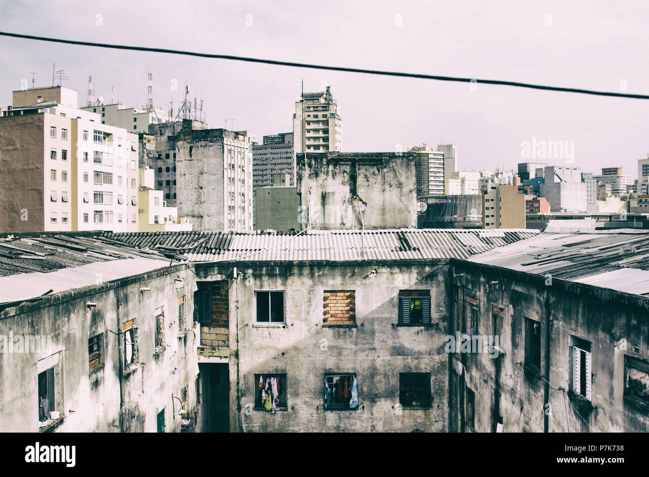 A ruined abandoned c shape building with square windows in San Paolo ...