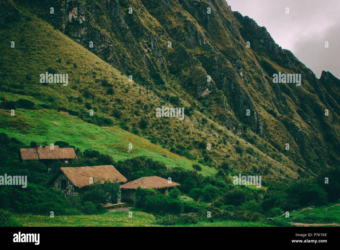 Along the Inca Trail houses are seen in Andes panorama. Peru. South ...