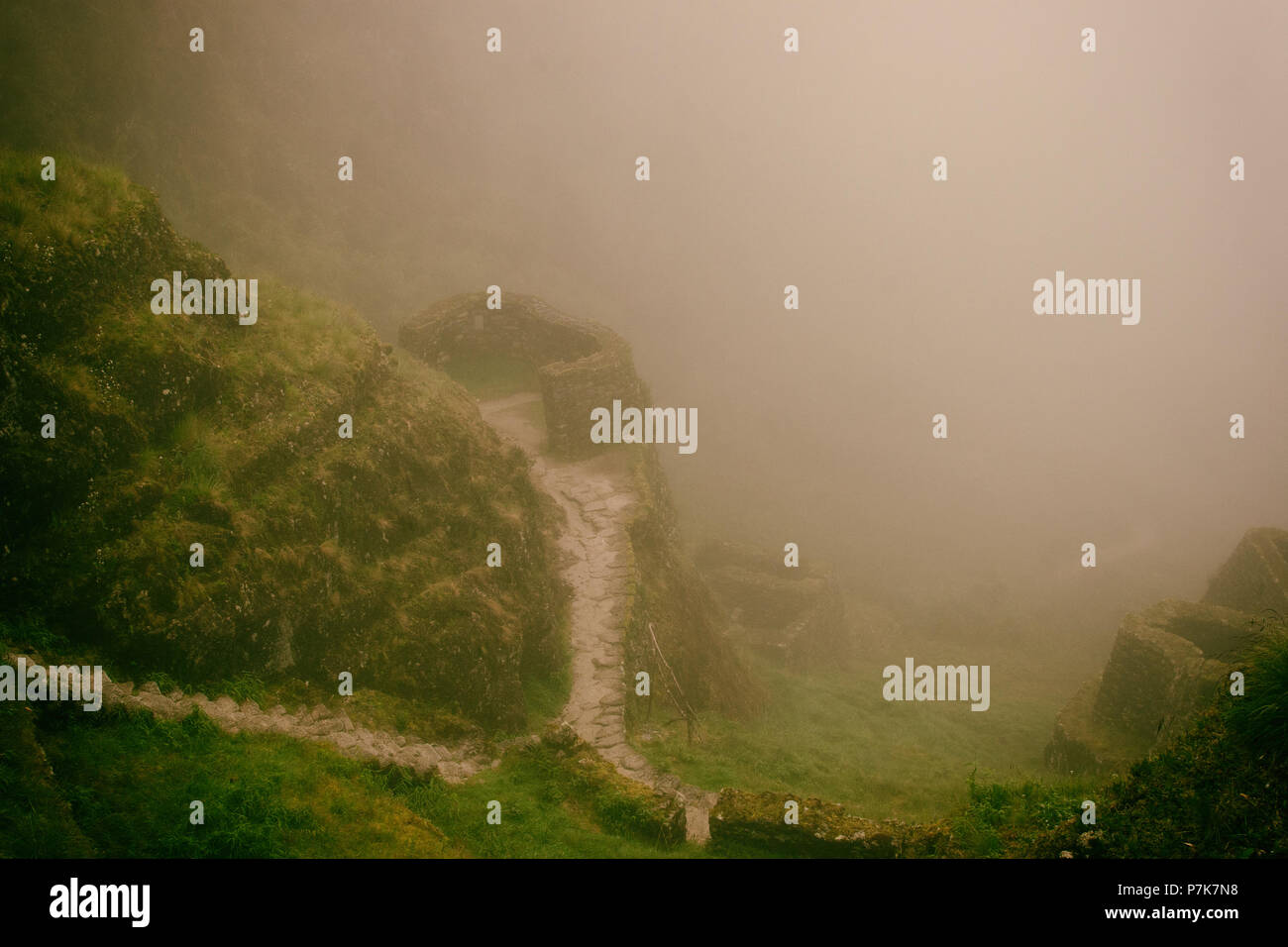 Historical ruins of the ancient Inca civilization covered by fog at ...