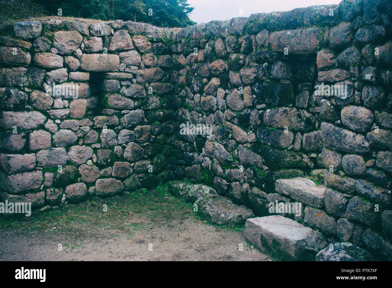 Stone magical ancient ruins along the paved path Inca Trail to Machu ...