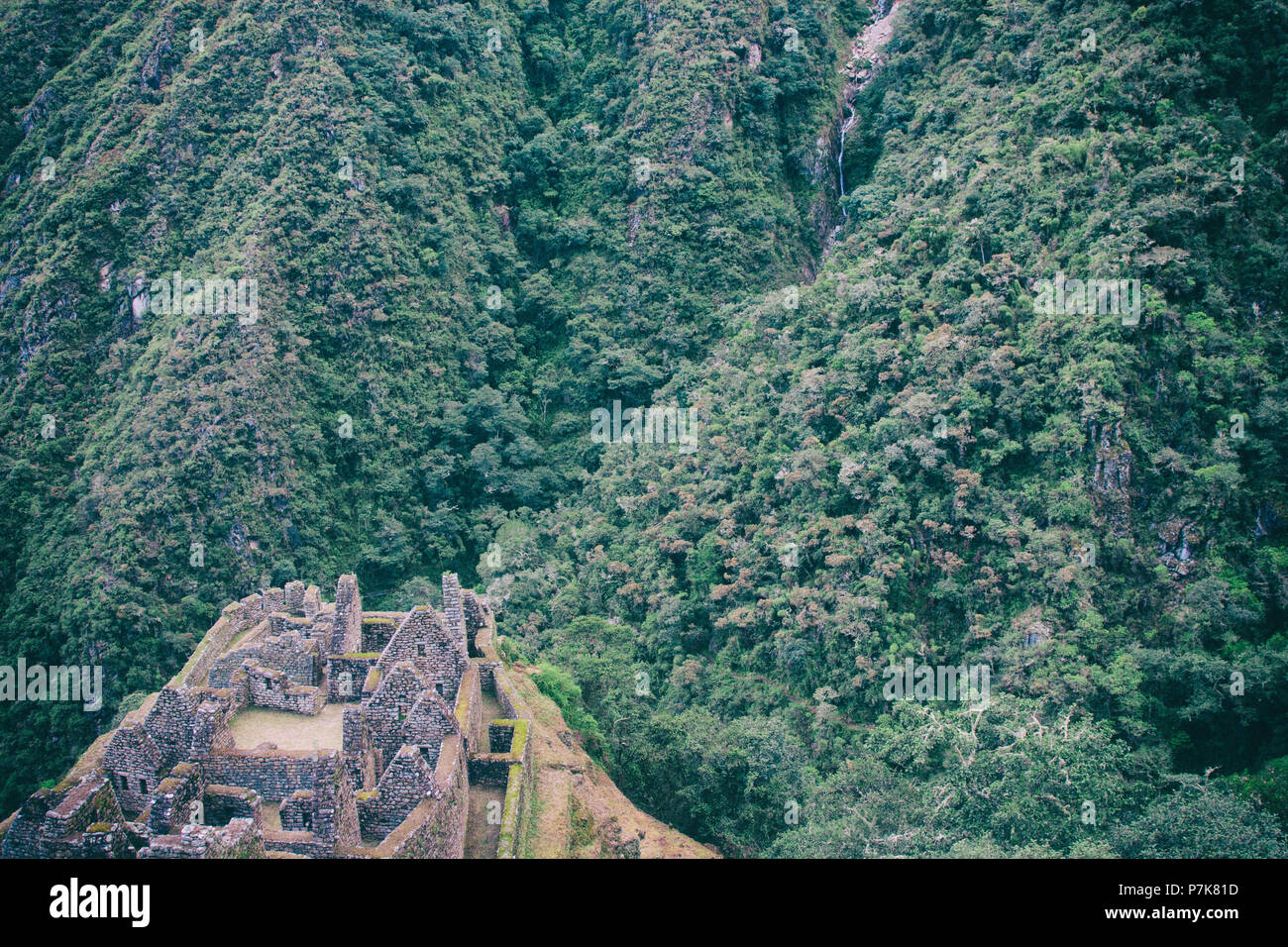Ancient stone ruins of an Inca town on the Inca Trail in the Andes ...