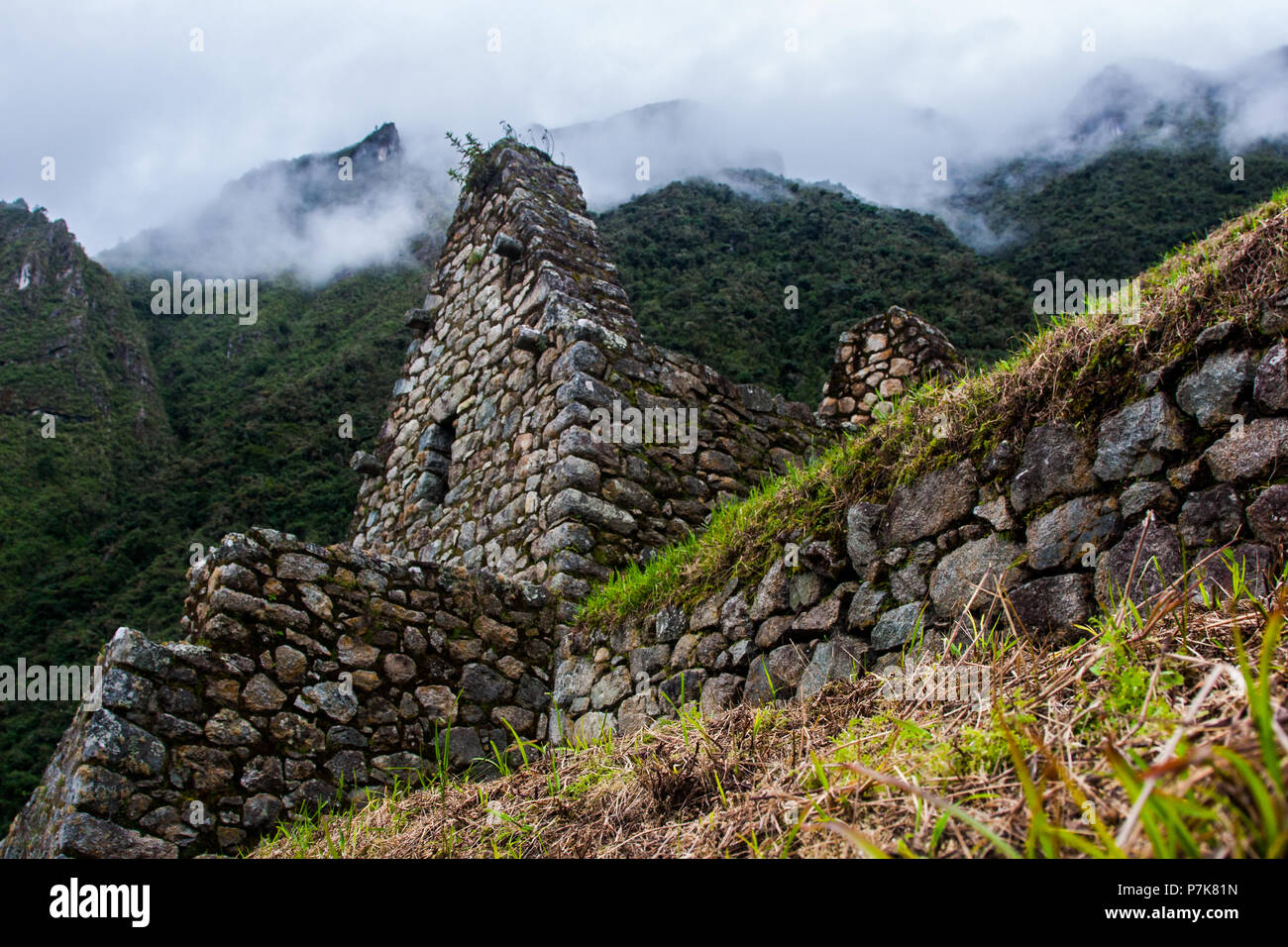 Ancient stone ruins of an Inca town on the Inca Trail in the Andes ...
