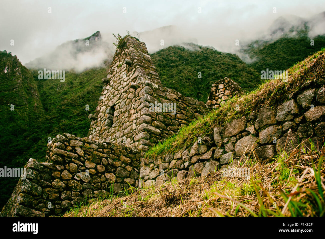 Ancient stone ruins of an Inca town on the Inca Trail in the Andes ...