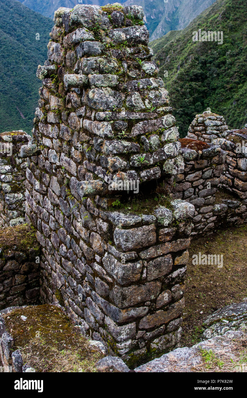 Ancient stone ruins of an Inca town on the Inca Trail in the Andes ...
