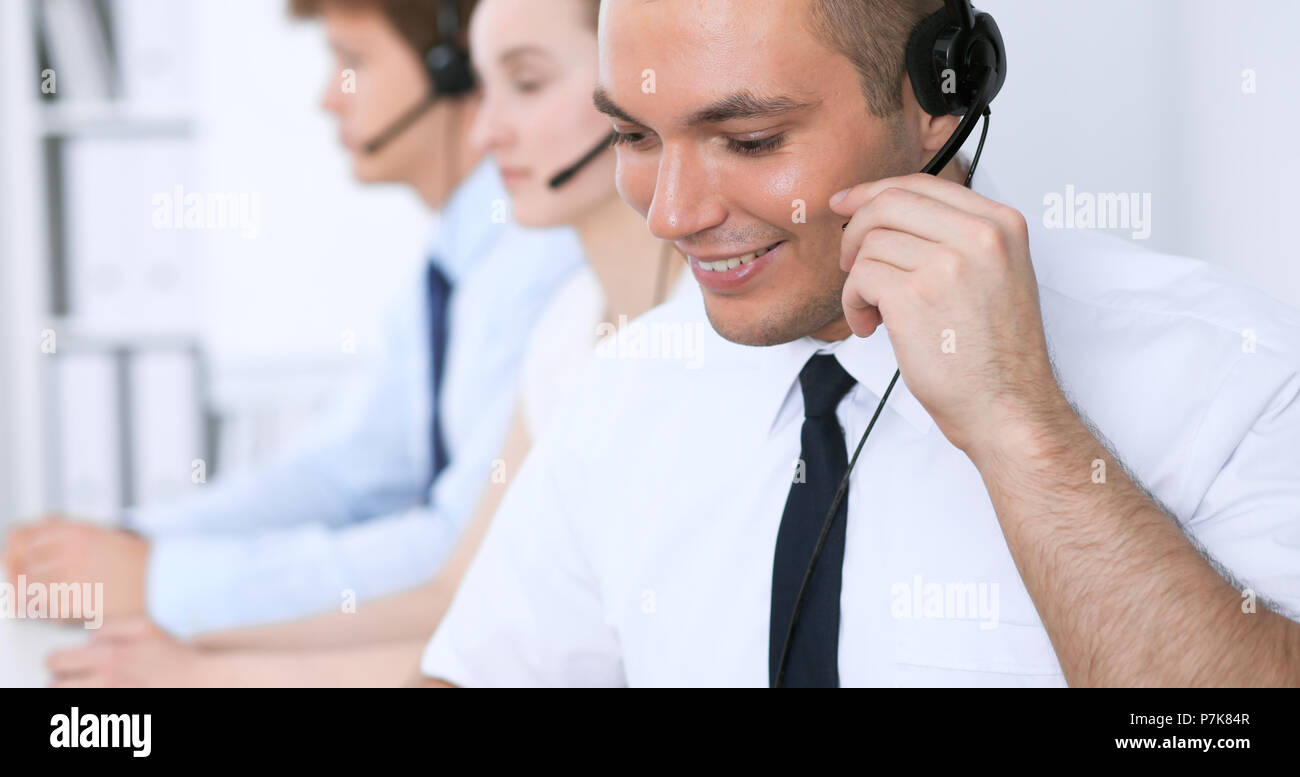 Young business man in headset. Call center Stock Photo - Alamy