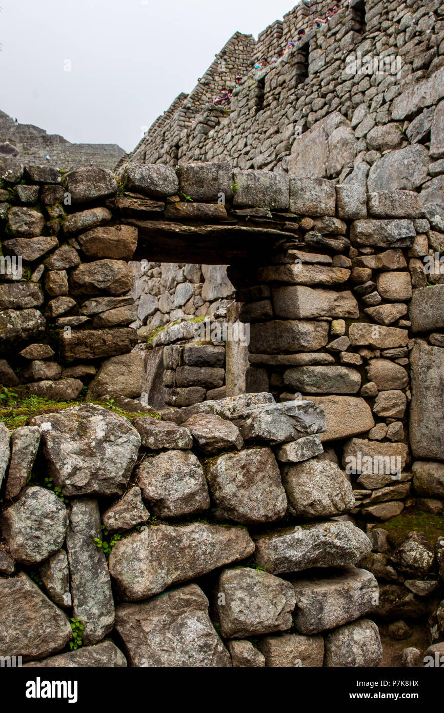 Stone magical ancient ruins along the paved path Inca Trail to Machu ...