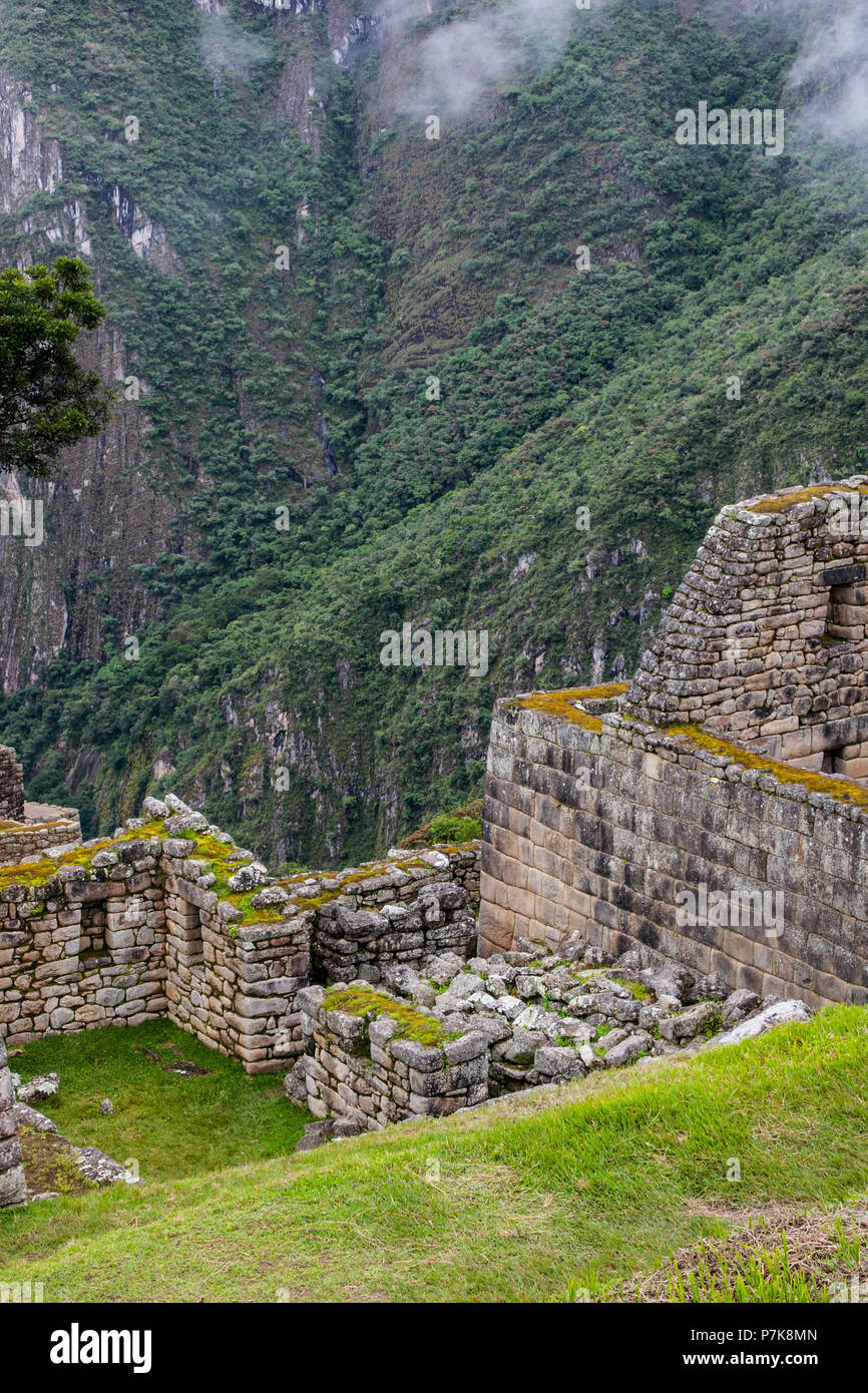 Vertical viiew of ruins of Machu Picchu Inca culture on a cliff in the ...