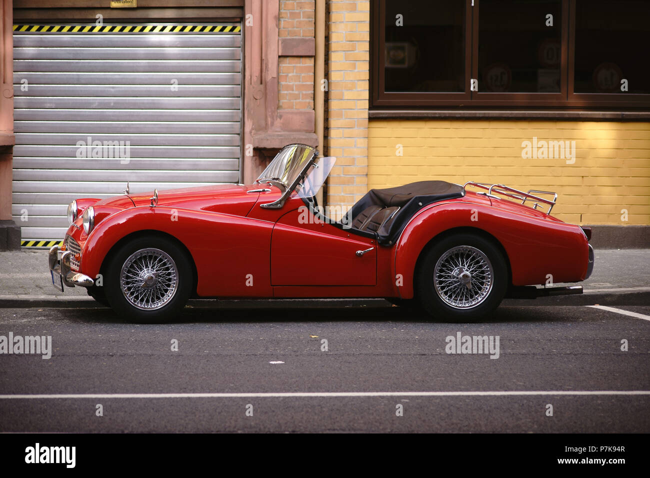 Side view of a red Triumph TR 3A roadster, sports car and classic car ...