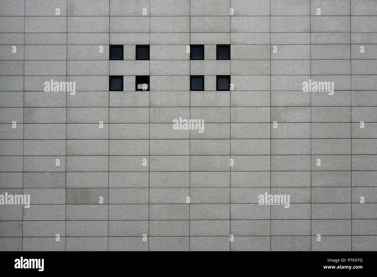 Facade of a modern shopping and commercial building with rectangular ...