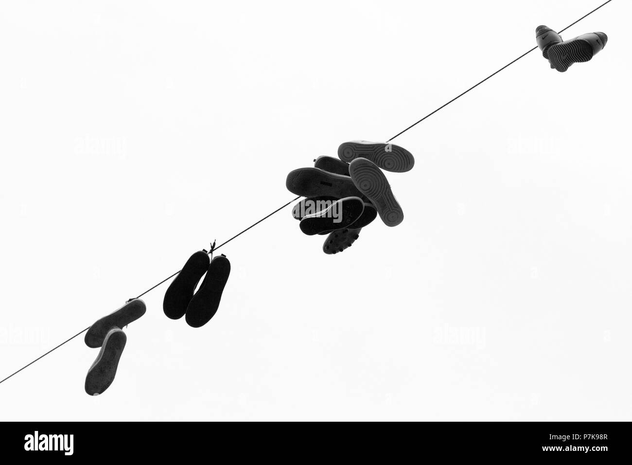 Dangling shoes hi-res stock photography and images - Alamy