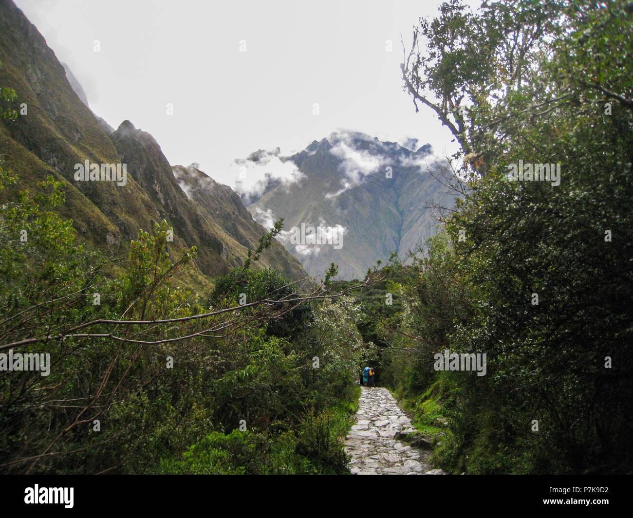 Ancient Inca Trail paved path to the lost city of Machu Picchu. Peru ...