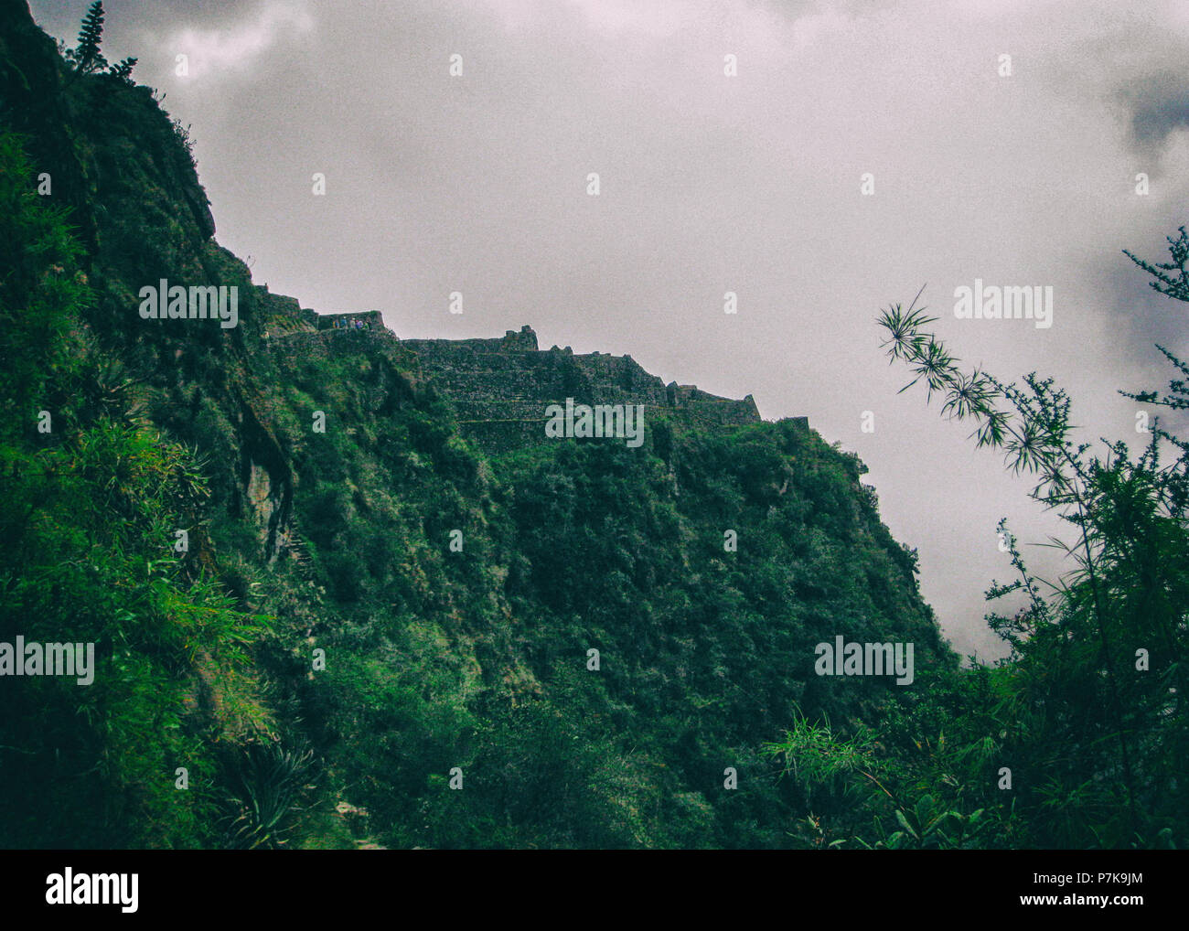 Ancient Inca Trail paved path to the lost city of Machu Picchu. Peru ...