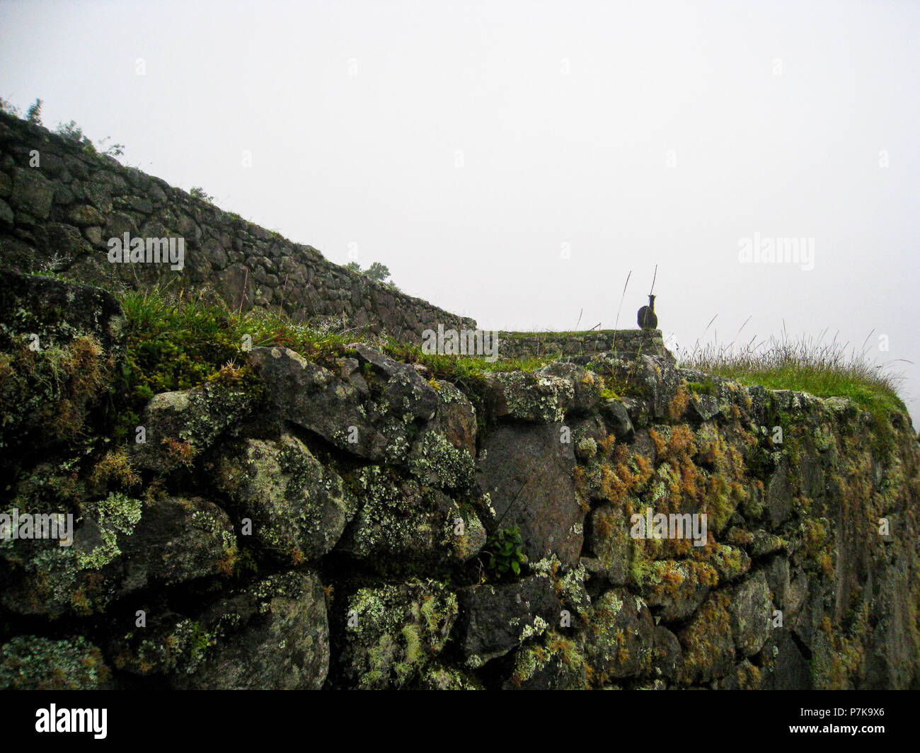 Ancient Inca stone wall and clouds in the background. Peru. South ...