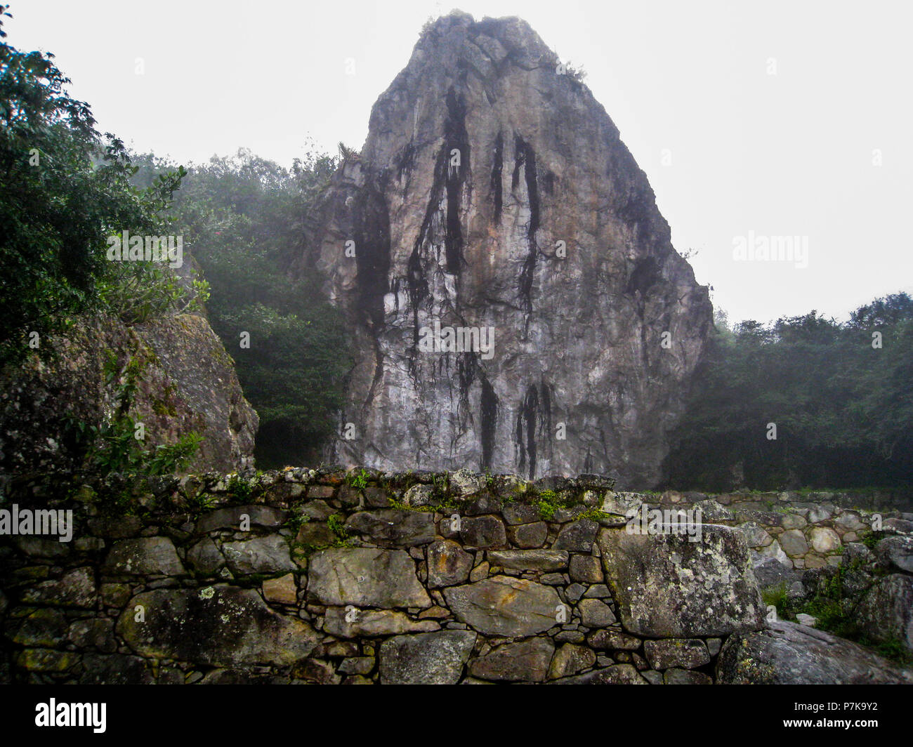 Stone magical ancient ruins along the paved path Inca Trail to Machu ...