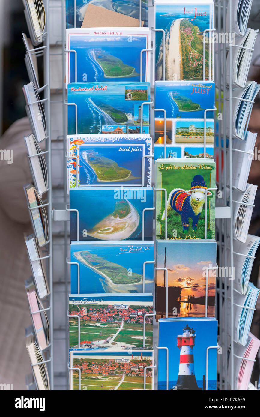 Germany, Lower Saxony, East Frisia, Juist, postcard stand in front of a ...
