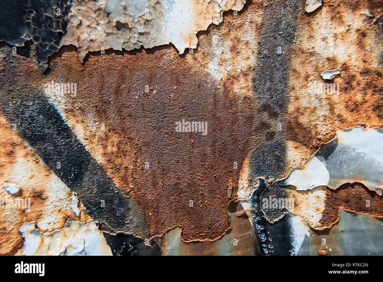 Worn rusty metal surface with pieces of old torn paper. Background ...