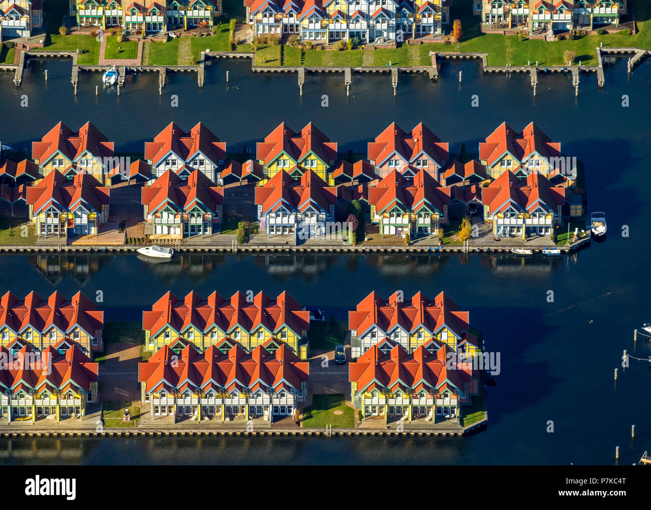 Holiday houses with landing stages, Rheinsberg Marina, lighthouse of ...