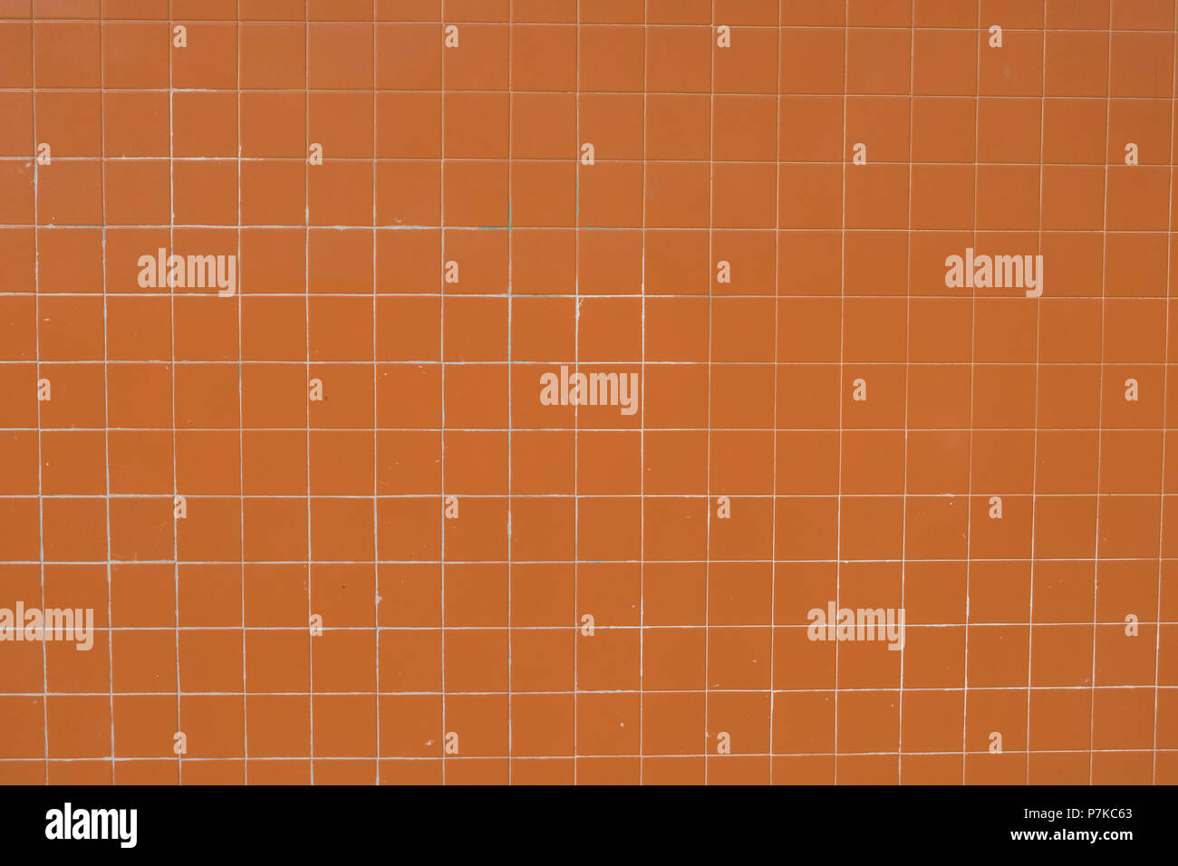 Wall surface made of orange tiles. Wallpaper image of textures Stock ...