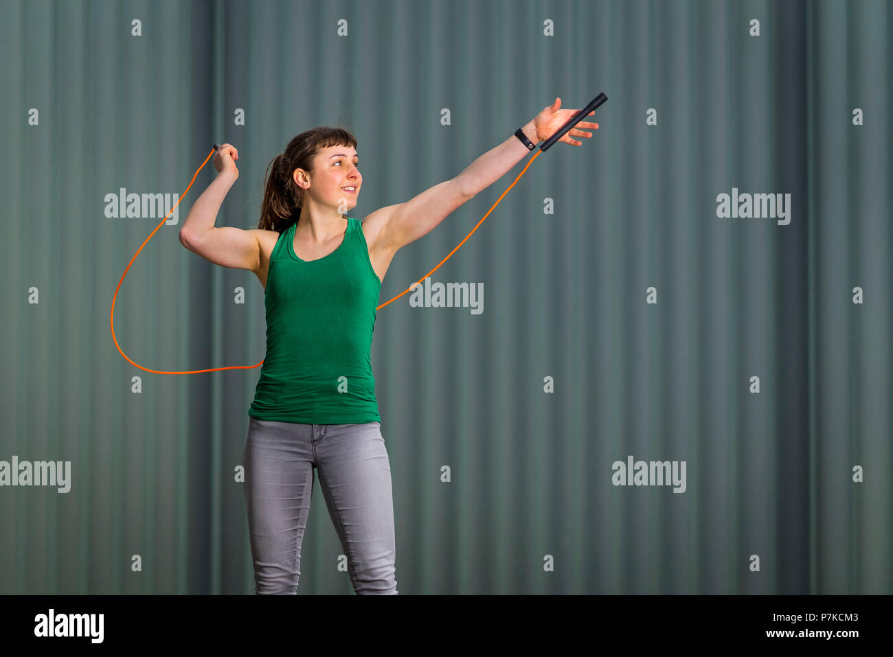 Teenager jumping rope, 18 years old, female, urban environment Stock ...