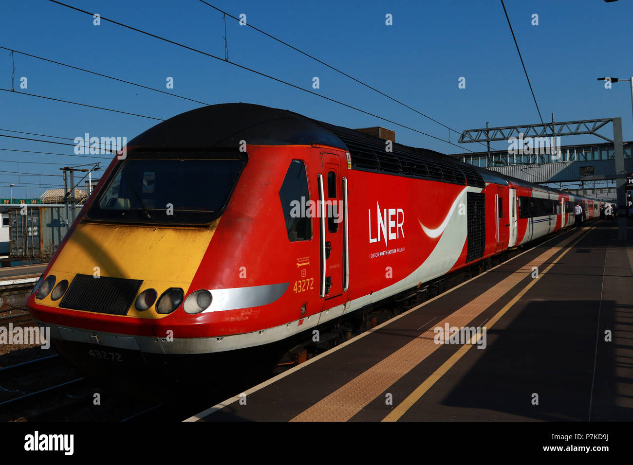 A train with LNER (London North Eastern Railway) livery at Peterborough ...