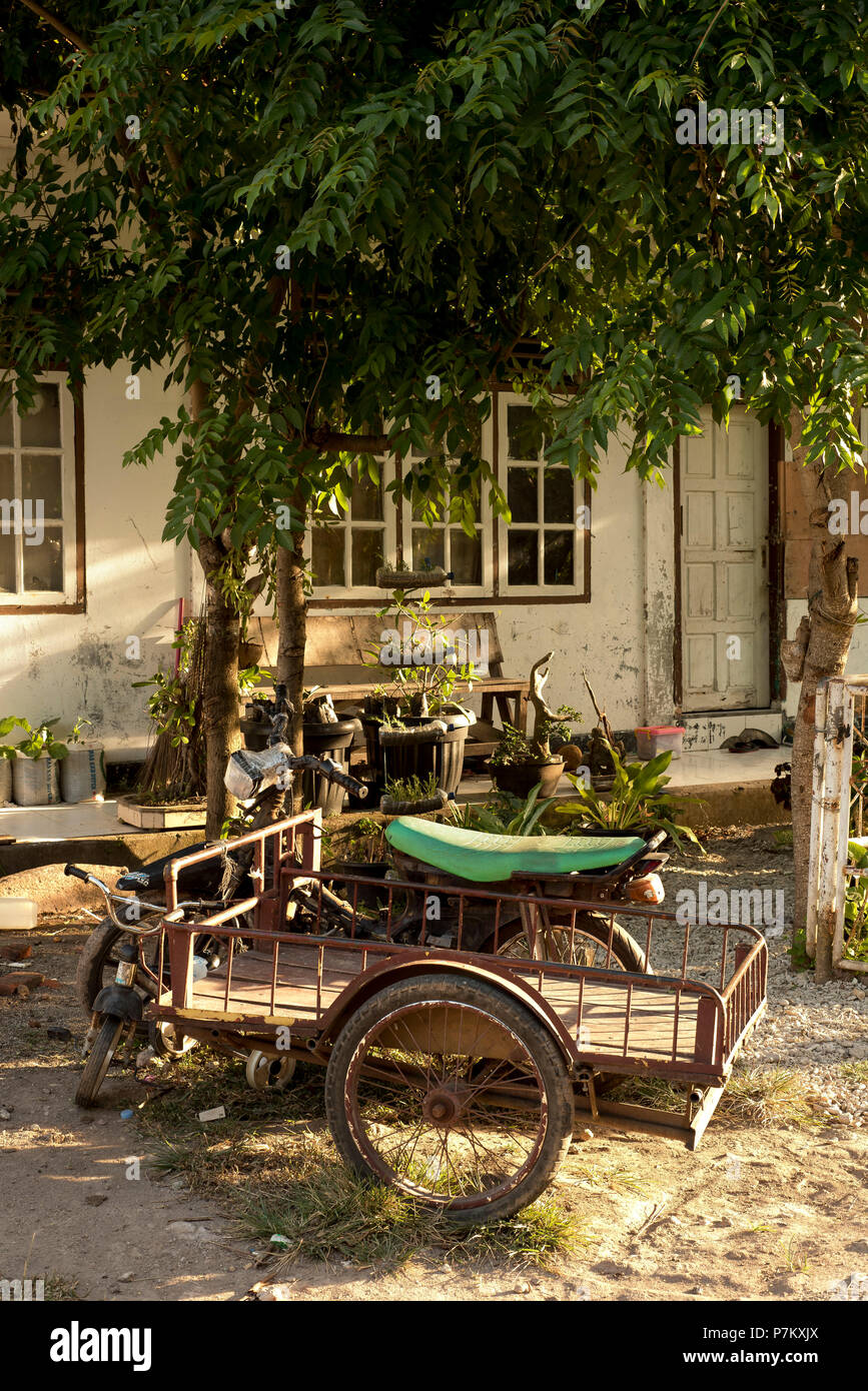An old rusty rickshaw in front of a house on Pulau Weh, Indonesia Stock ...