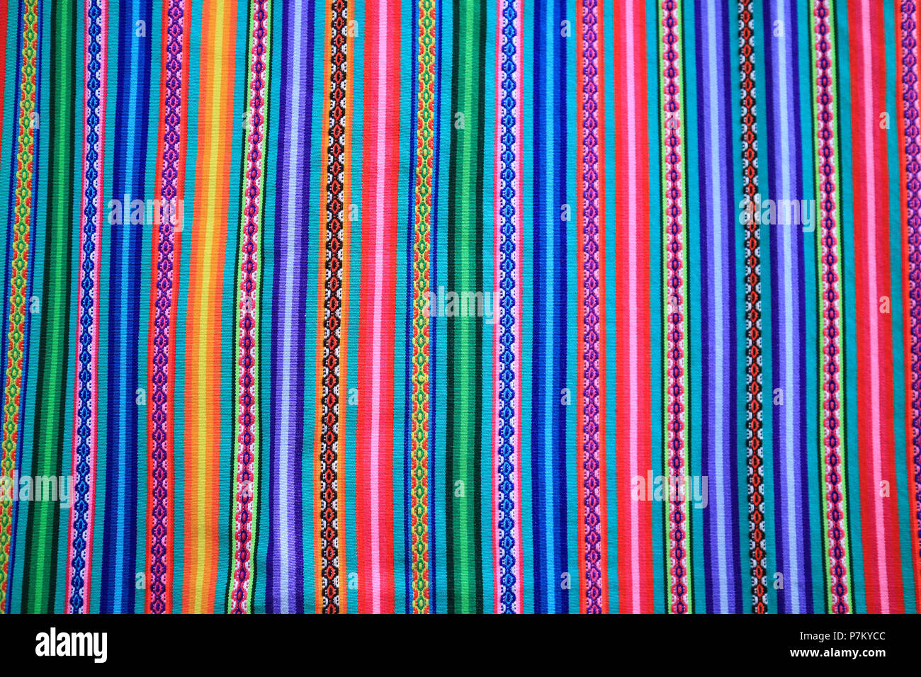 Multi color vivid tone stripe of Peruvian fabric for background, banner ...