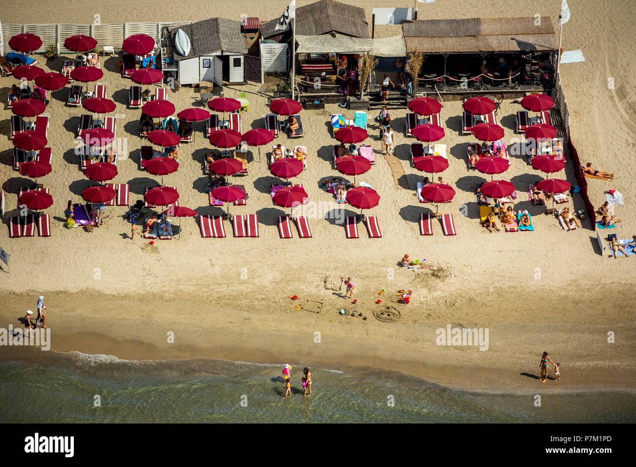 Beach bar with sun loungers and beach umbrellas, on the Mediterranean ...