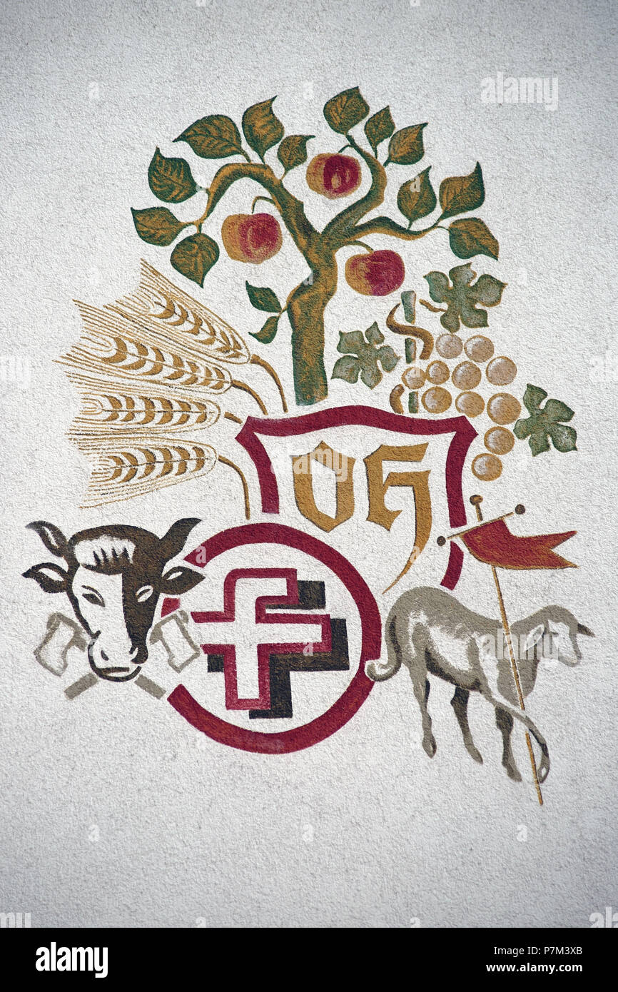 The coat of arms of a farm on the wall of a building in Taunusstein ...