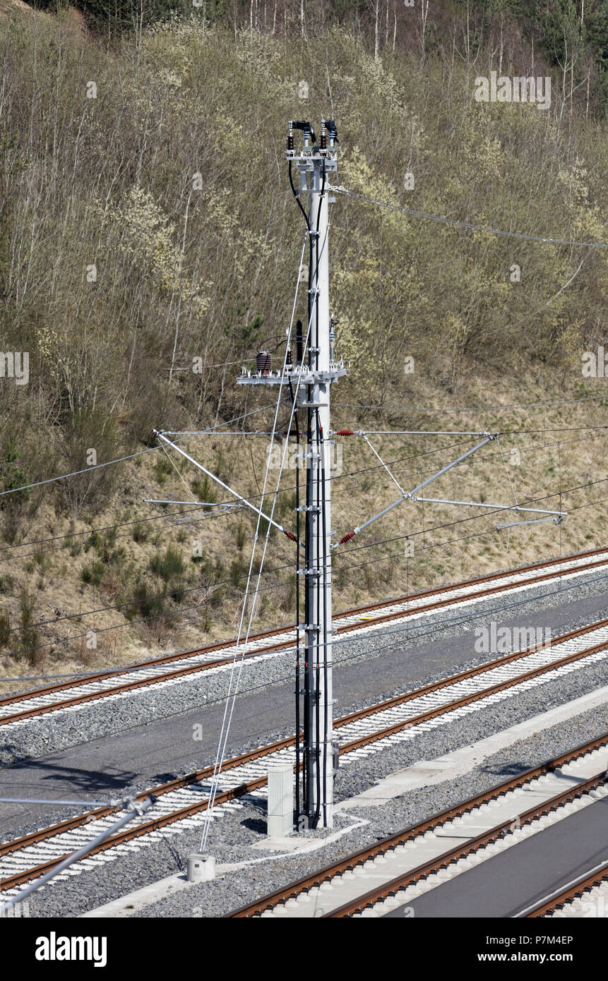Mast, insulators, wires, tracks Stock Photo - Alamy