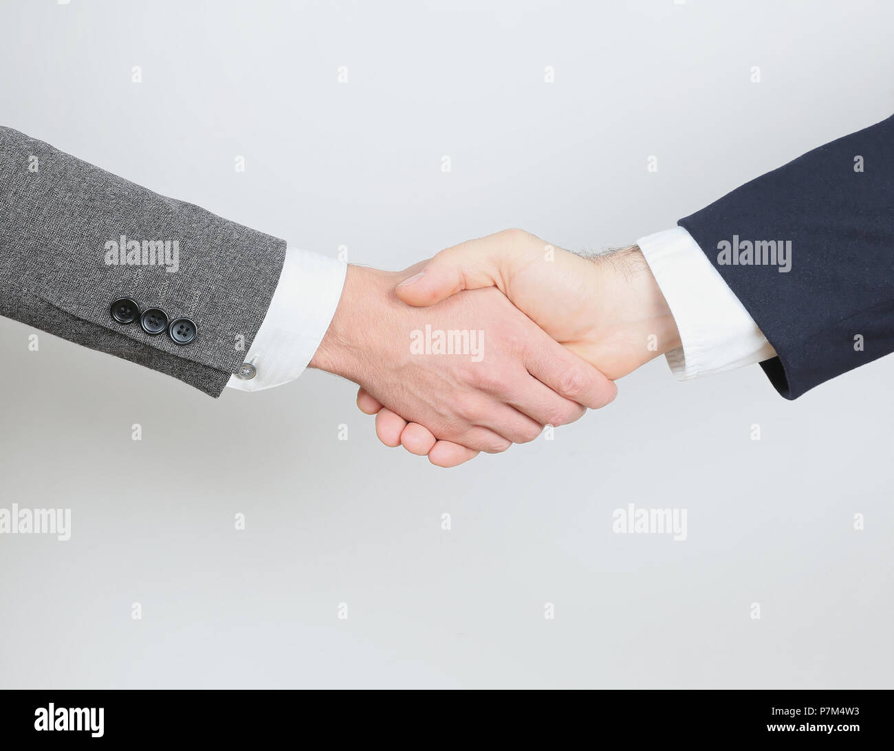 Business Handshake of Two Man in Suits Stock Photo - Alamy