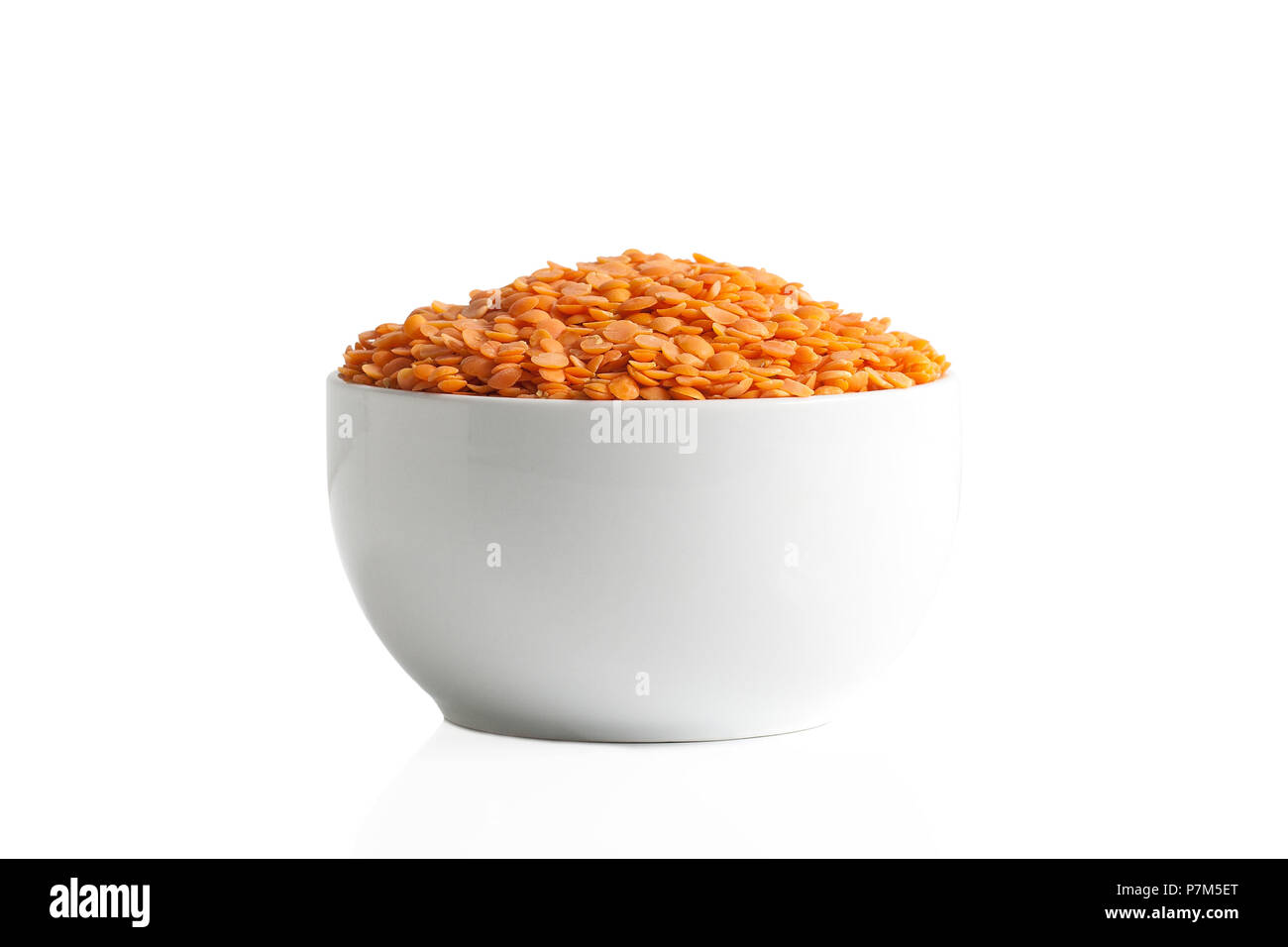 A cup of red lentils isolated on a white background Stock Photo - Alamy