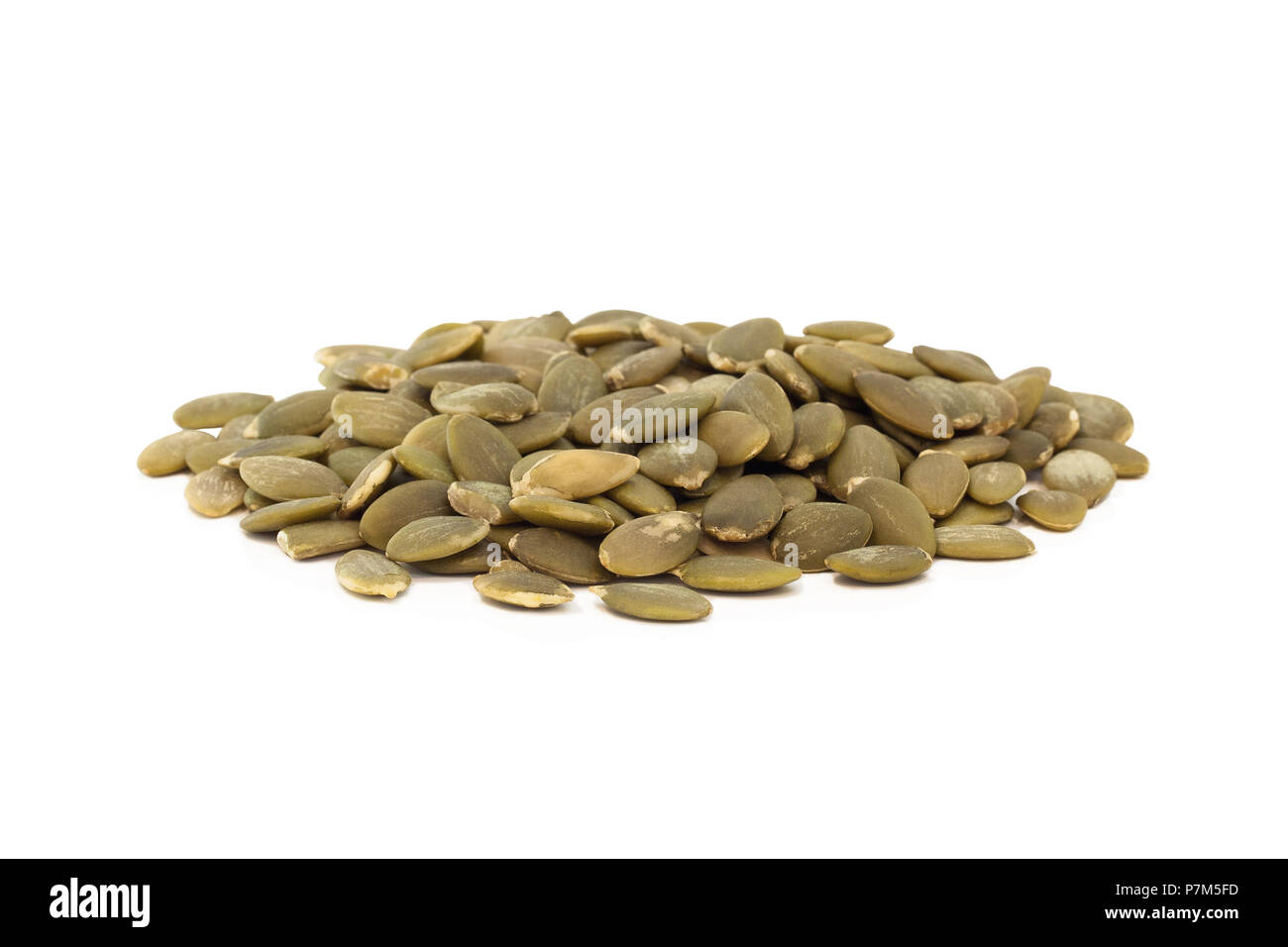 A stack of pumpkin seeds isolated on white background Stock Photo - Alamy