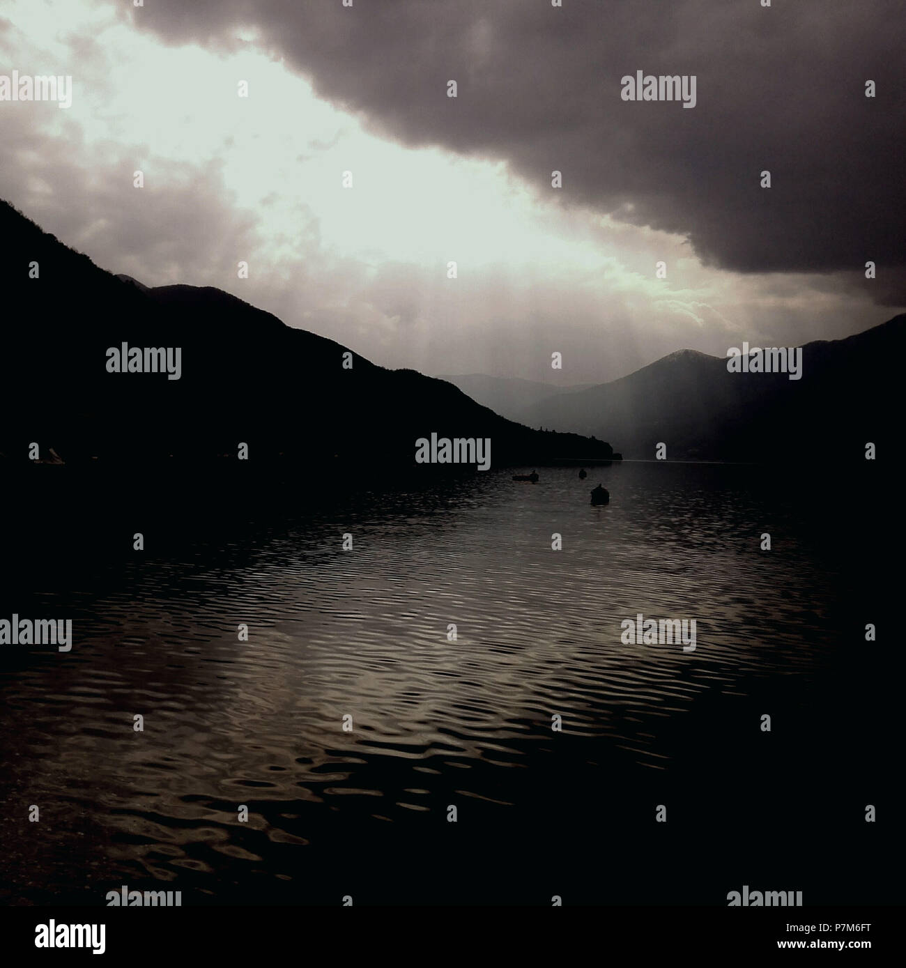 Dramatic light above the dark lake Stock Photo - Alamy