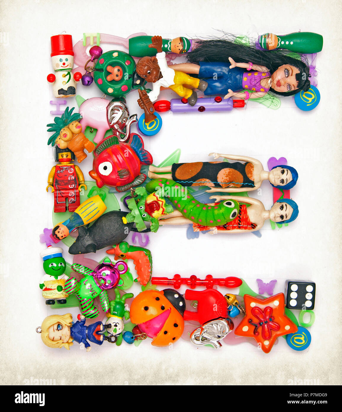 the letter E made from small toys Stock Photo - Alamy