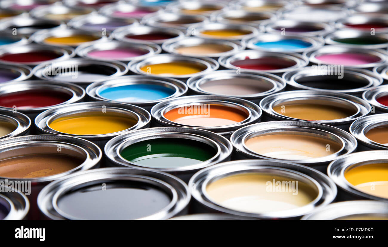 Full Buckets of rainbow colored oil paint Stock Photo - Alamy