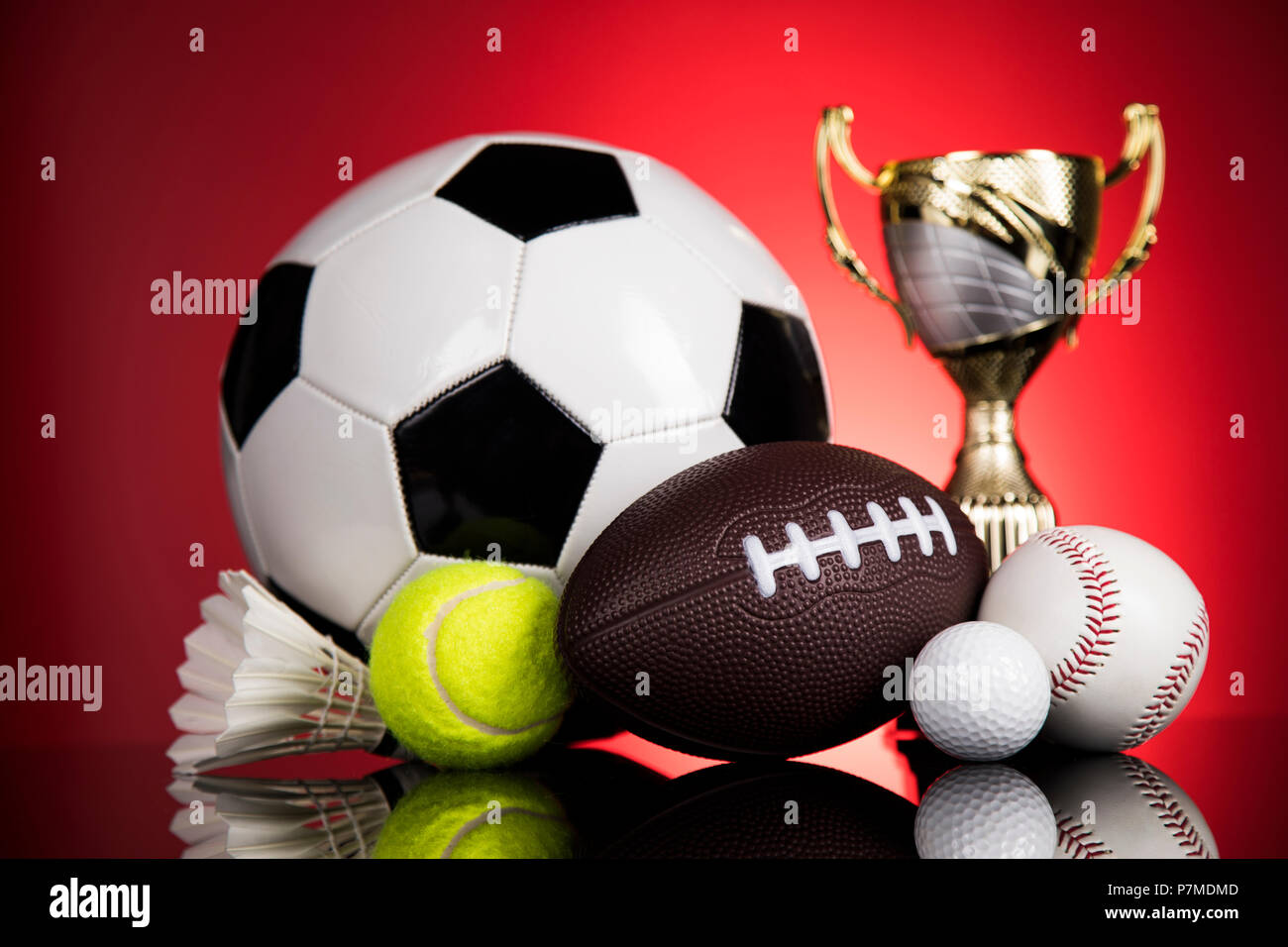 Cups of winners award, Sport equipment and balls Stock Photo - Alamy