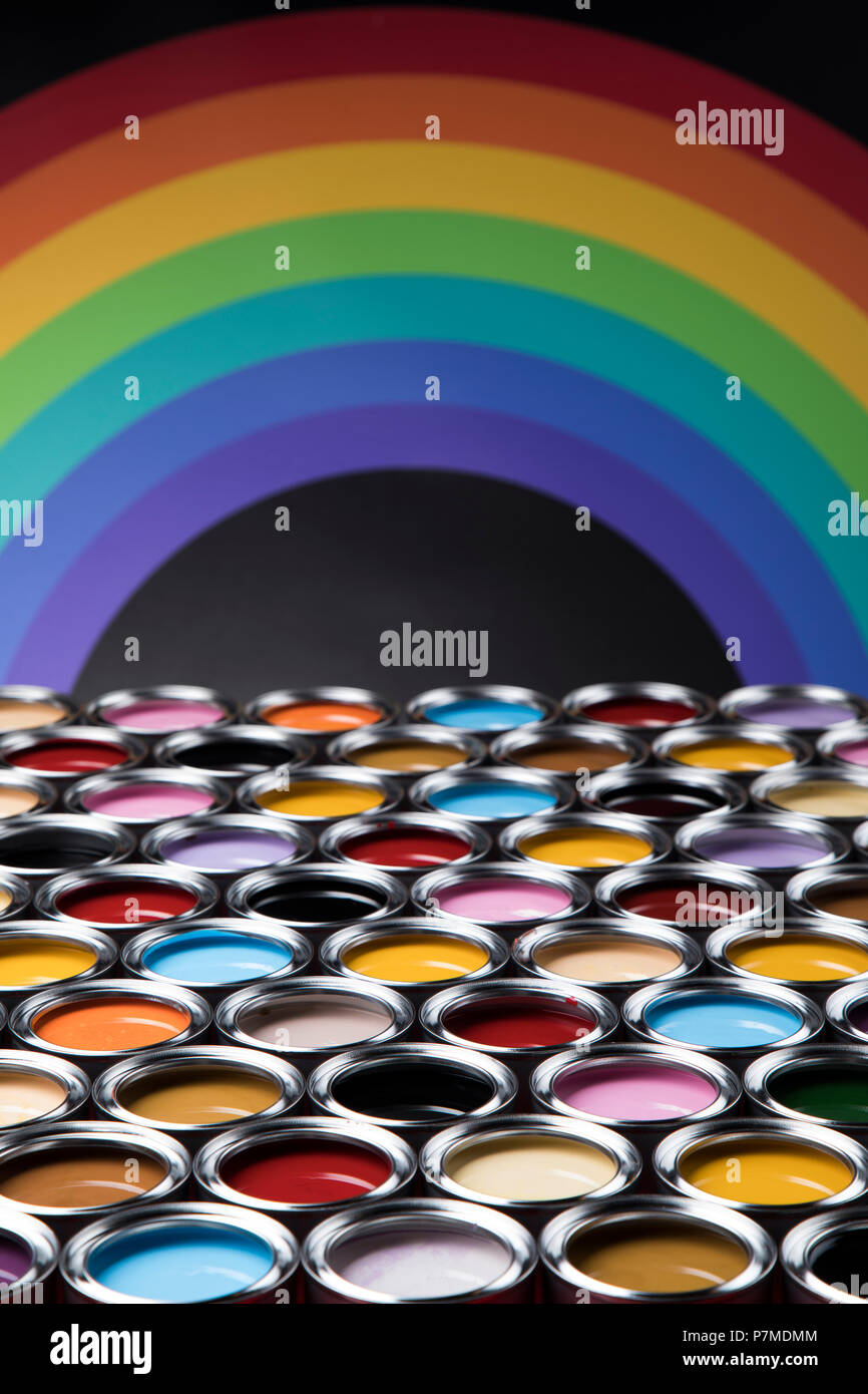 Rainbow colors, Open cans of paint Stock Photo - Alamy