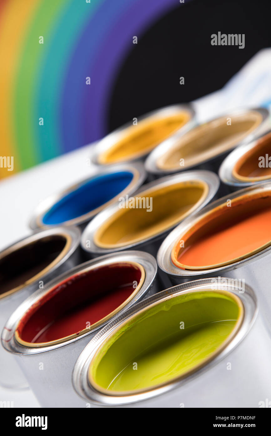 Full Buckets of rainbow colored oil paint Stock Photo - Alamy