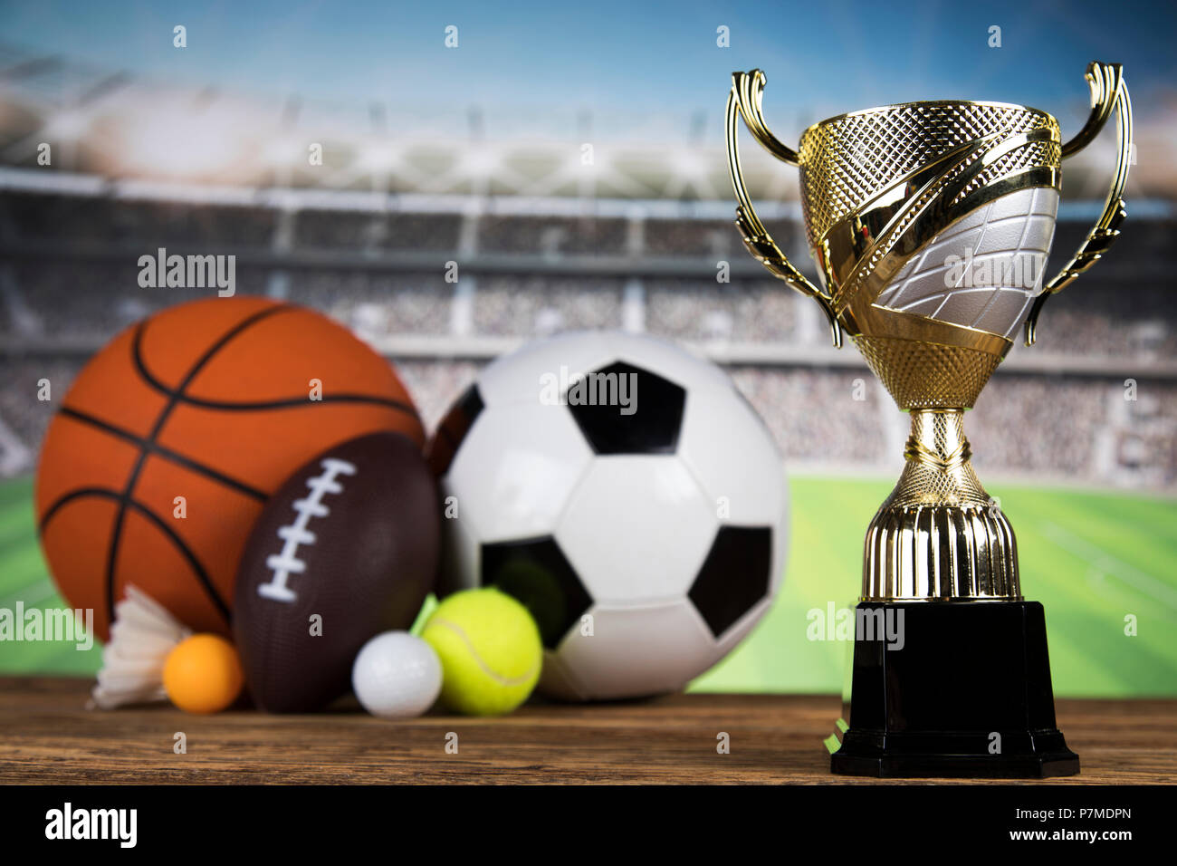Cups of winners award, Sport equipment and balls Stock Photo - Alamy