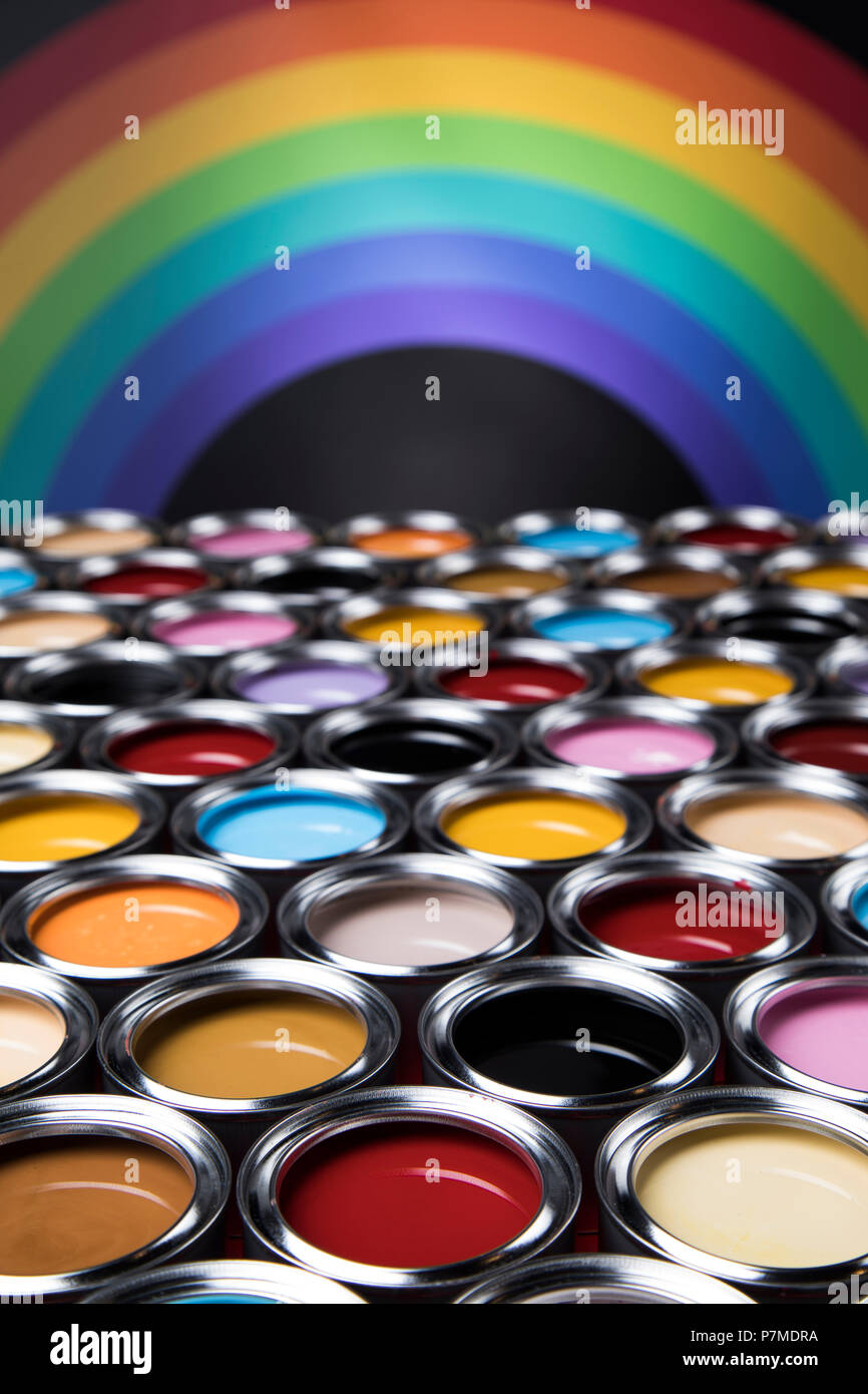 Full Buckets of rainbow colored oil paint Stock Photo - Alamy