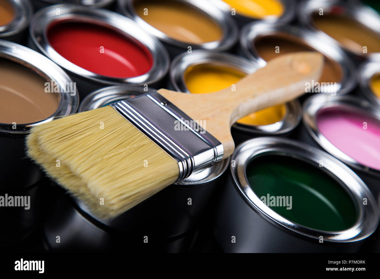 Colorful paint cans with paintbrush Stock Photo - Alamy