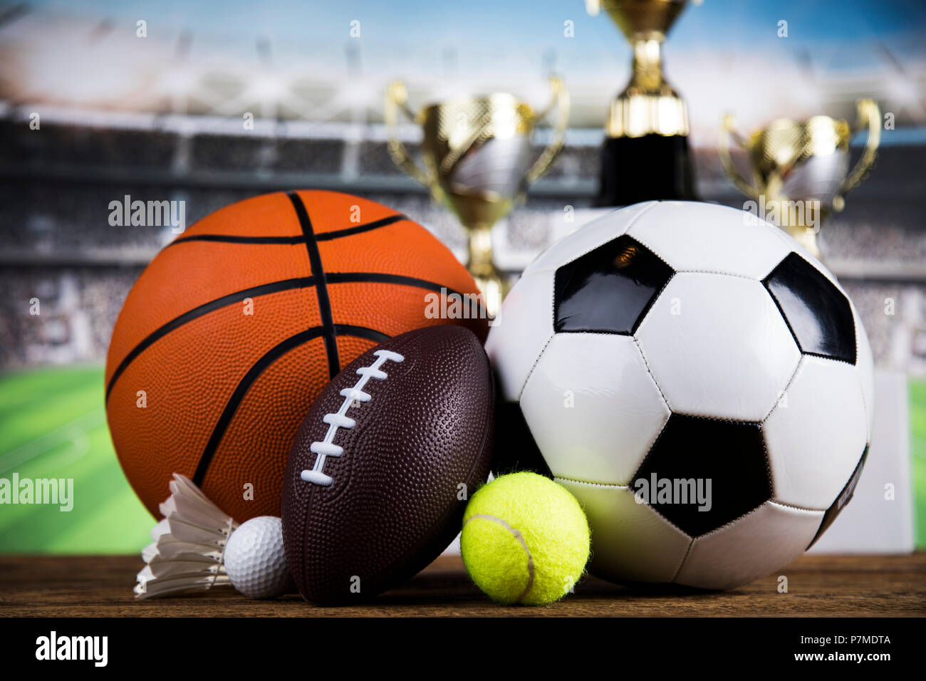Cups of winners award, Sport equipment and balls Stock Photo - Alamy