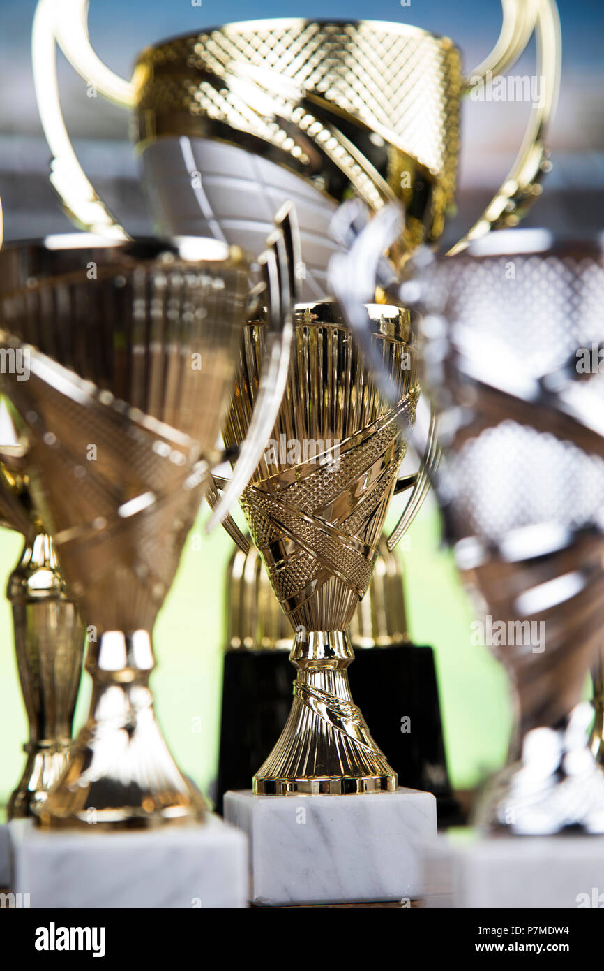 Award winning and championship concept, trophy cup on sport background ...