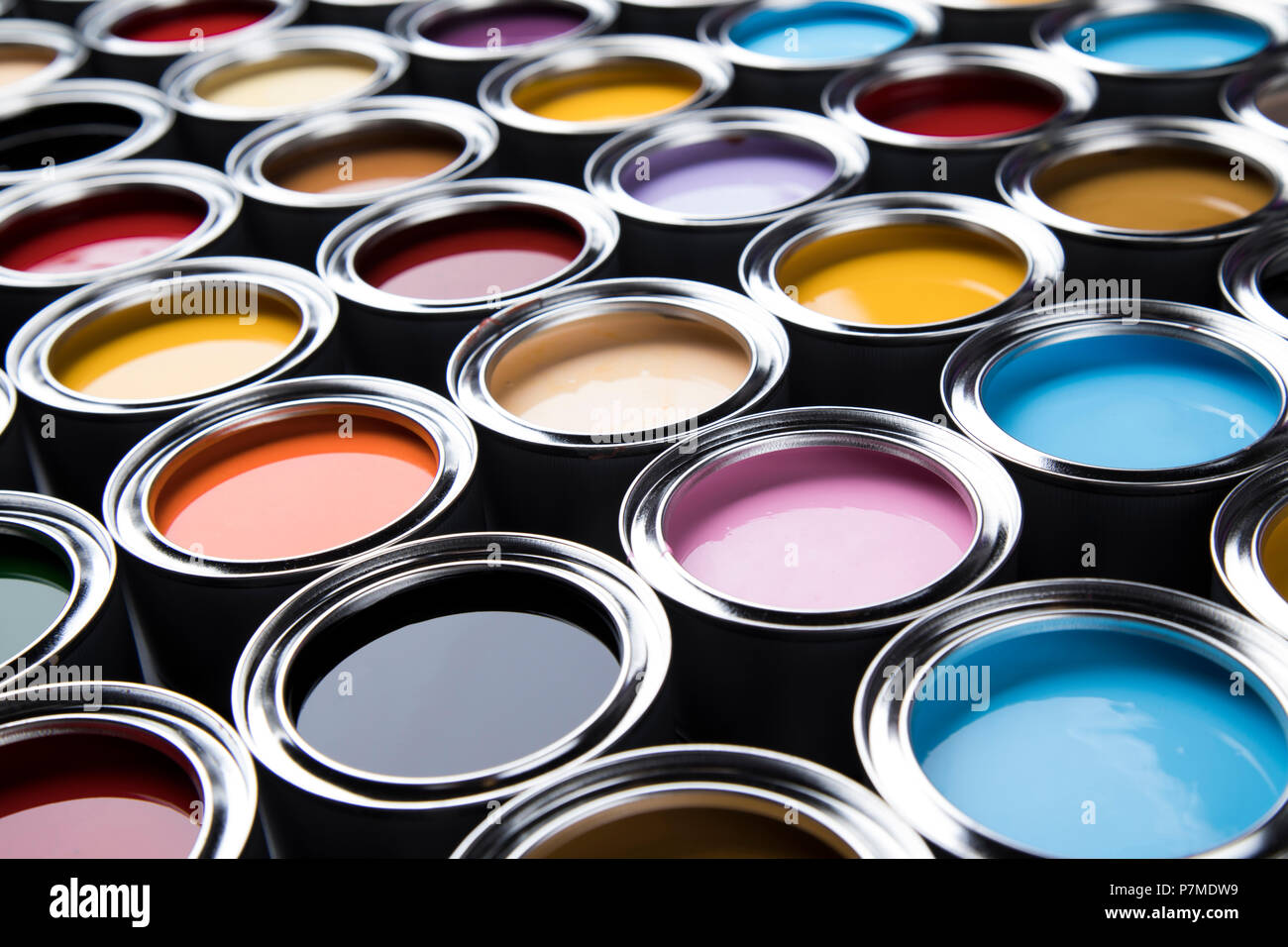 Group of tin metal cans with color paint Stock Photo - Alamy