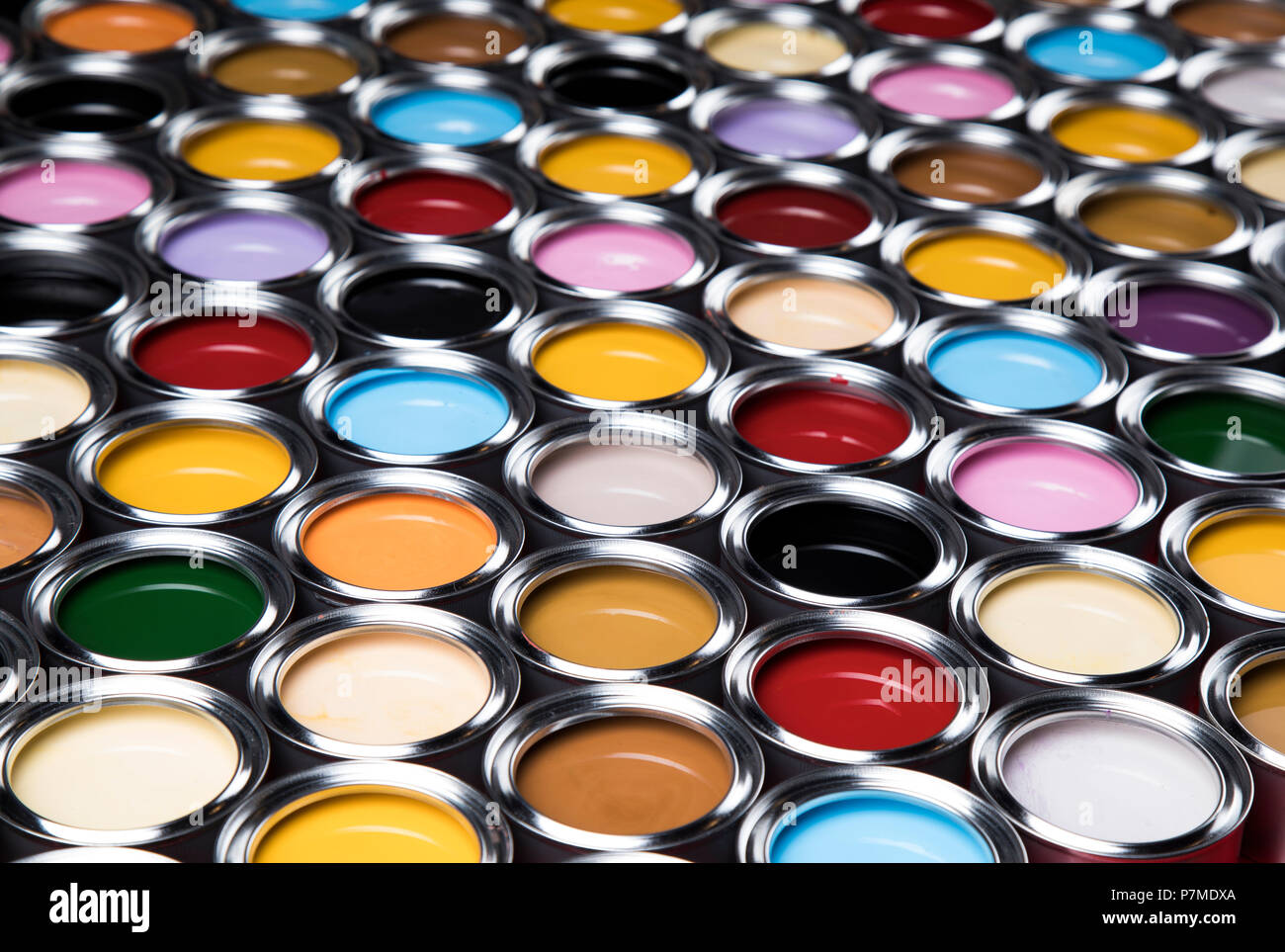 Group of tin metal cans with color paint Stock Photo - Alamy