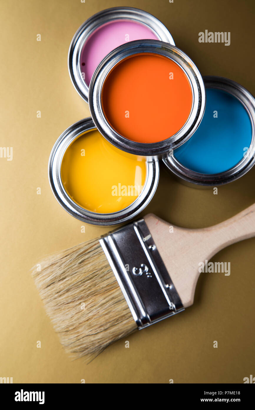 Tin cans with paint, brushes and bright palette of colors Stock Photo ...