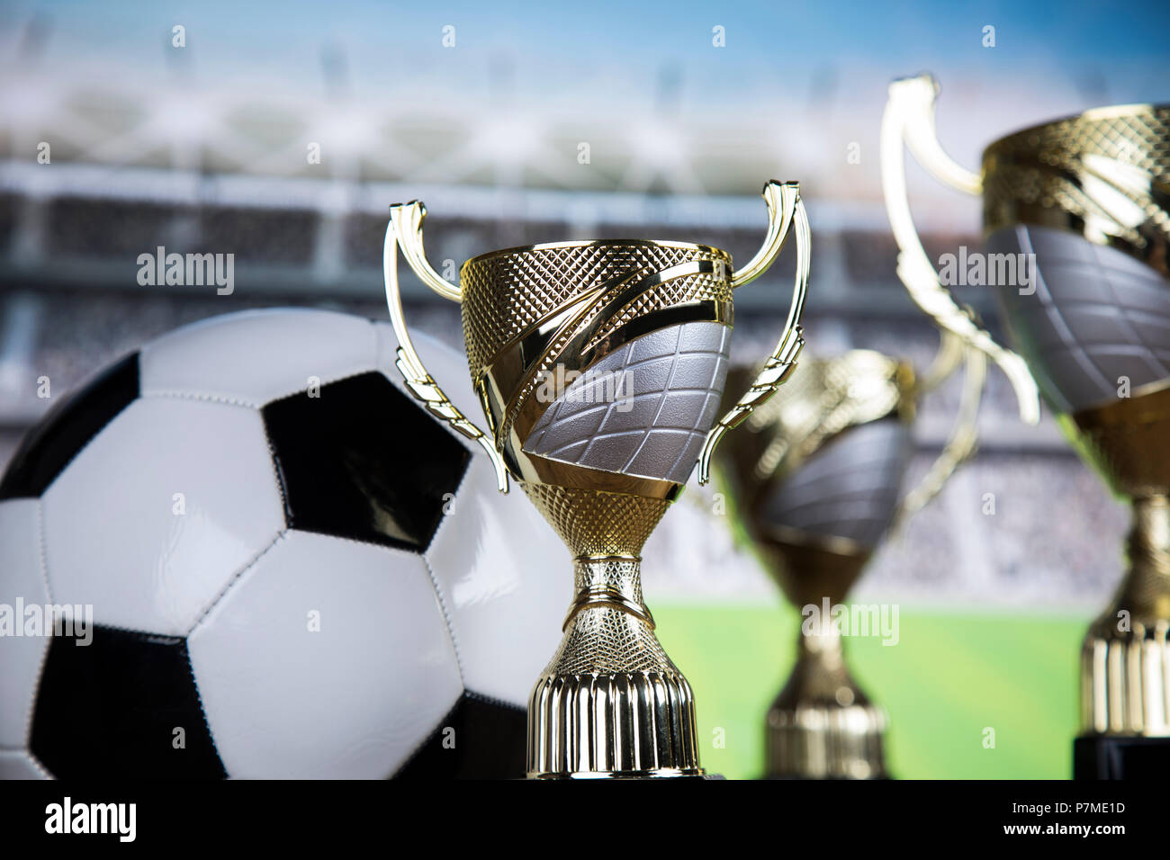 Cups of winners award, Sport equipment and balls Stock Photo - Alamy