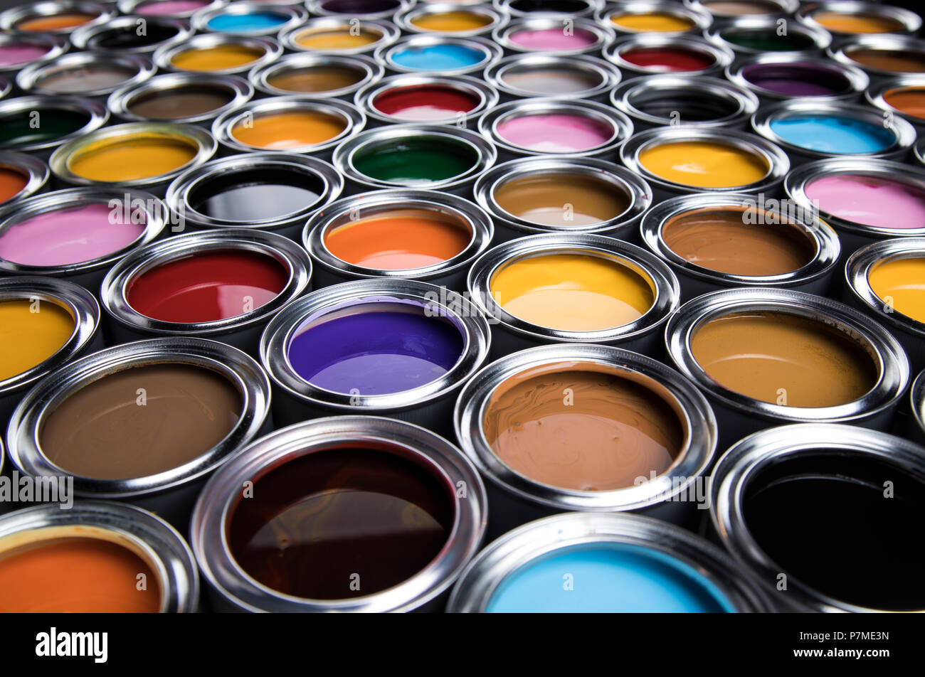 Group of tin metal cans with color paint Stock Photo - Alamy