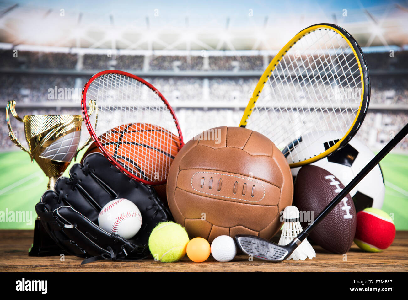 Cups of winners award, Sport equipment and balls Stock Photo - Alamy