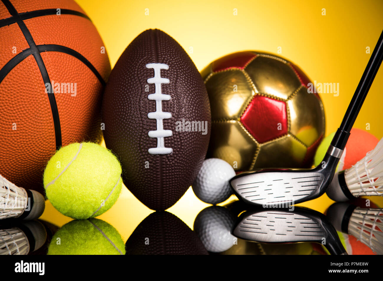 Cups of winners award, Sport equipment and balls Stock Photo - Alamy